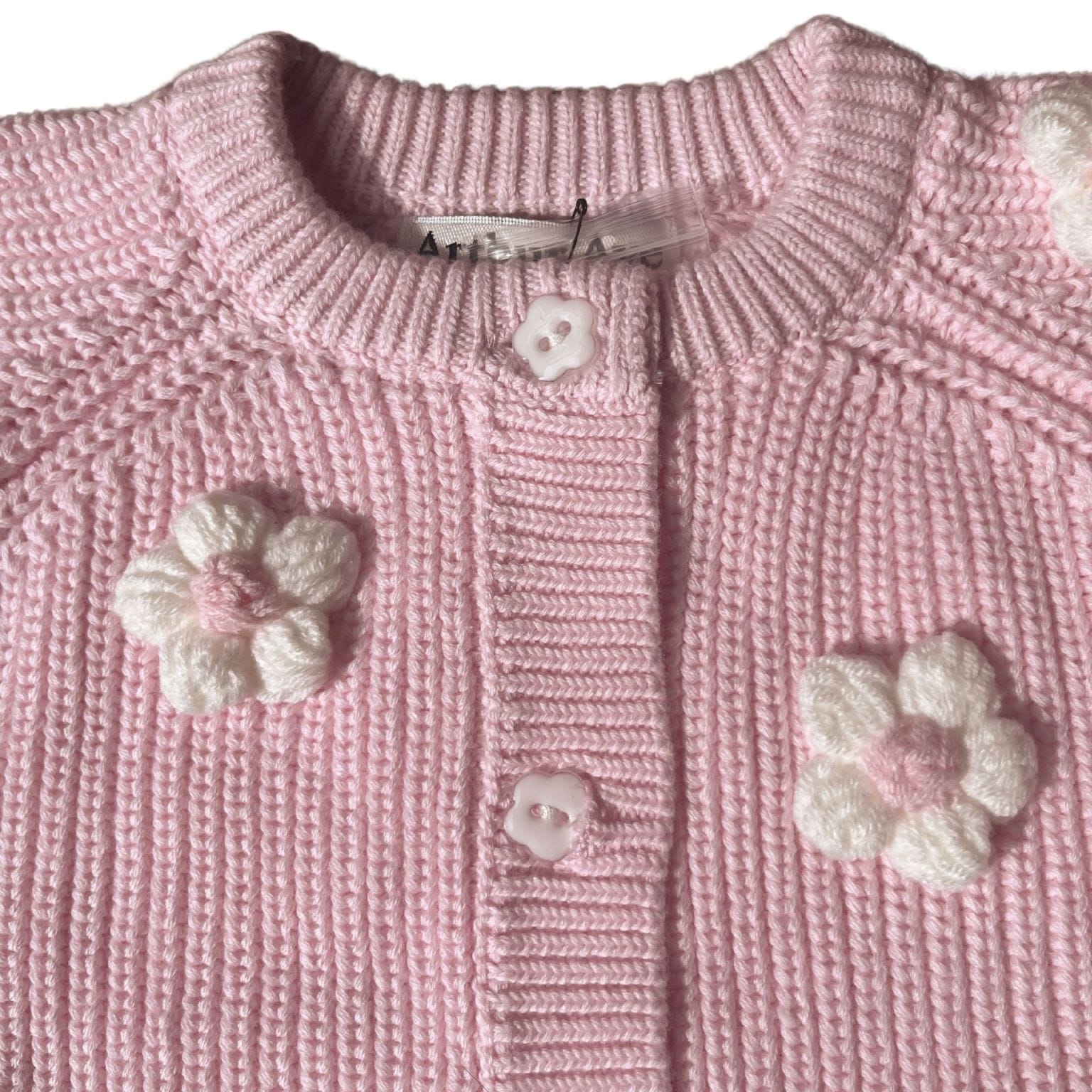 Our delicate girls pink flower cardigan keeps her warm comfy